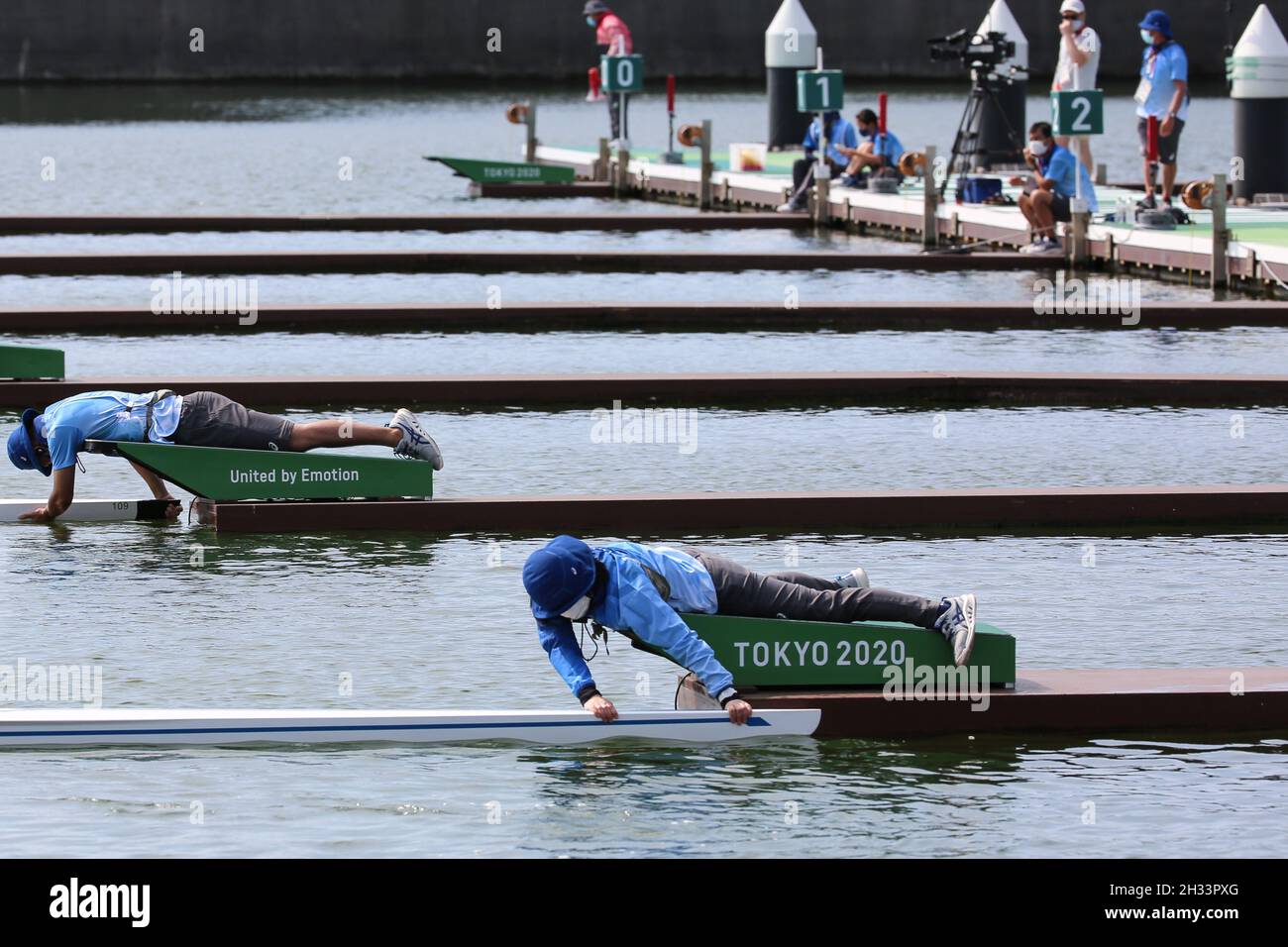 JULY 23rd, 2021 - TOKYO, JAPAN: boat helpers in action before the start ...