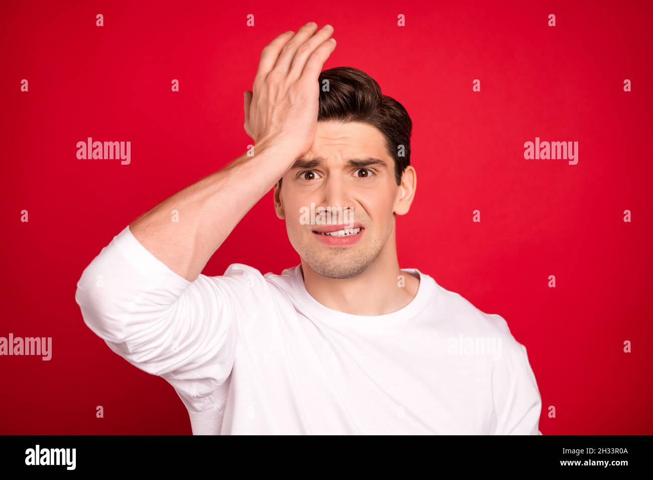 Photo portrait brunet in white shirt forgot did mistake got problem ...