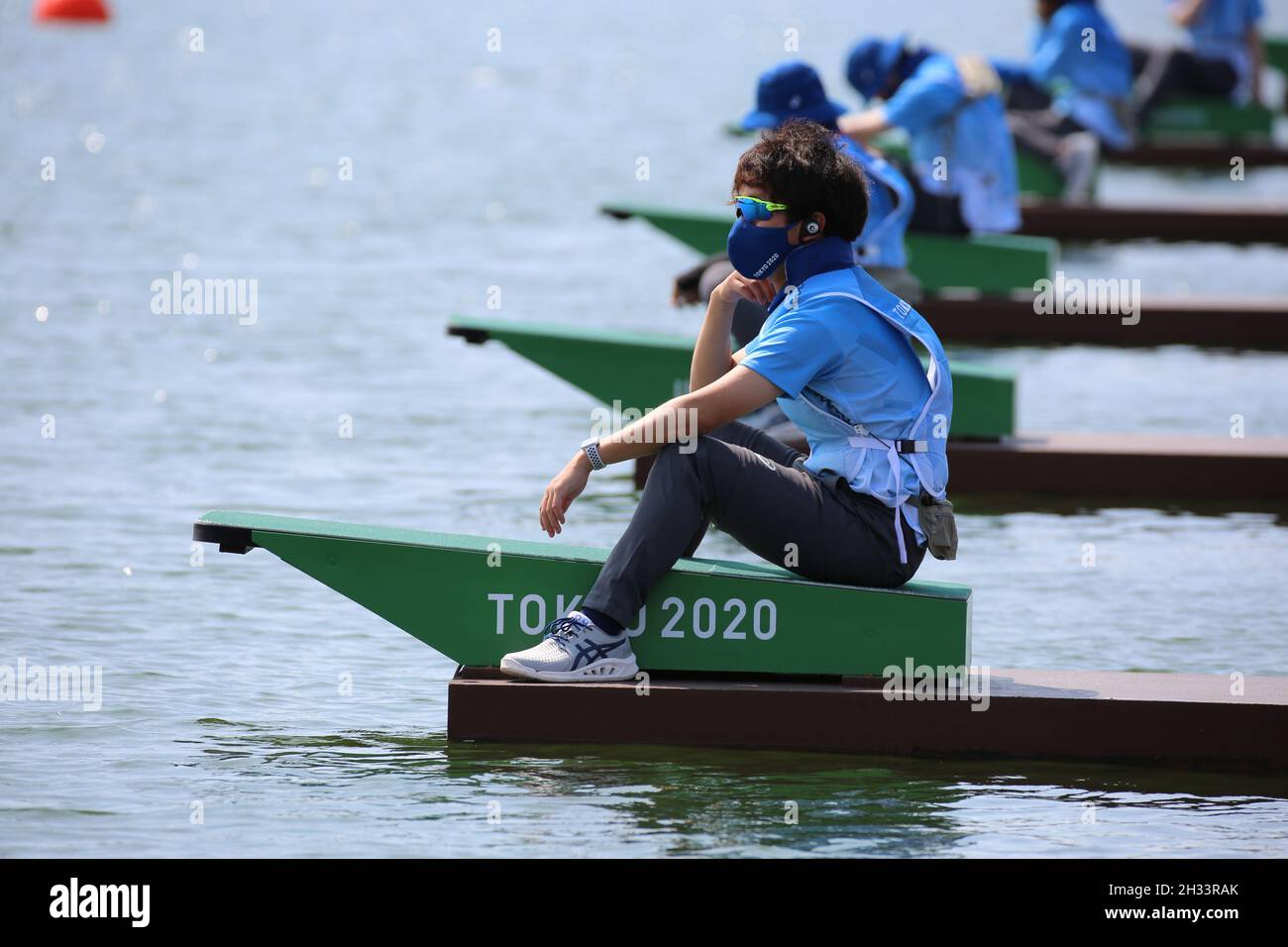 JULY 23rd, 2021 - TOKYO, JAPAN: a boat helper looks a race during the ...
