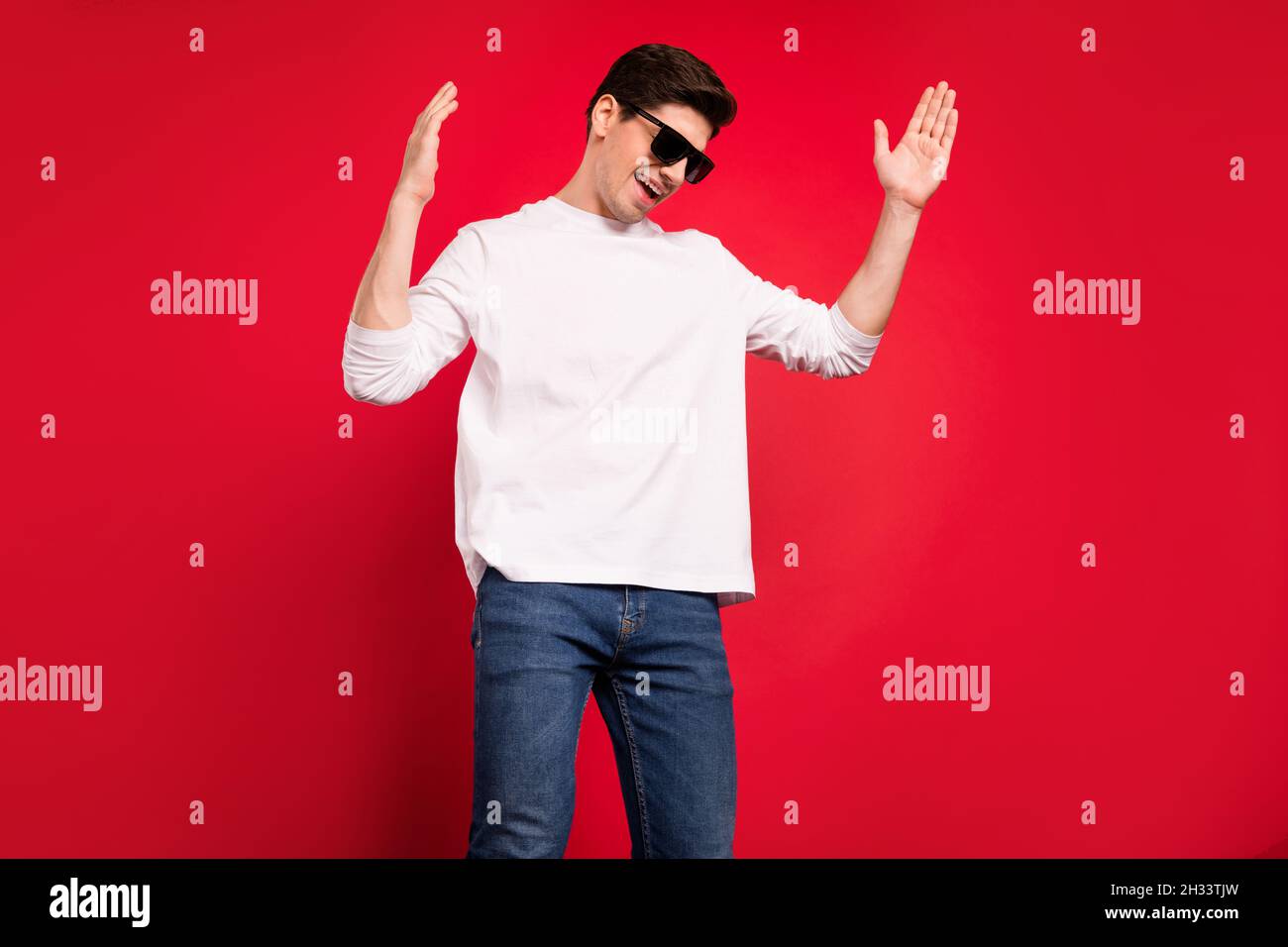 Photo of crazy brunet millennial guy dance wear white shirt spectacles ...