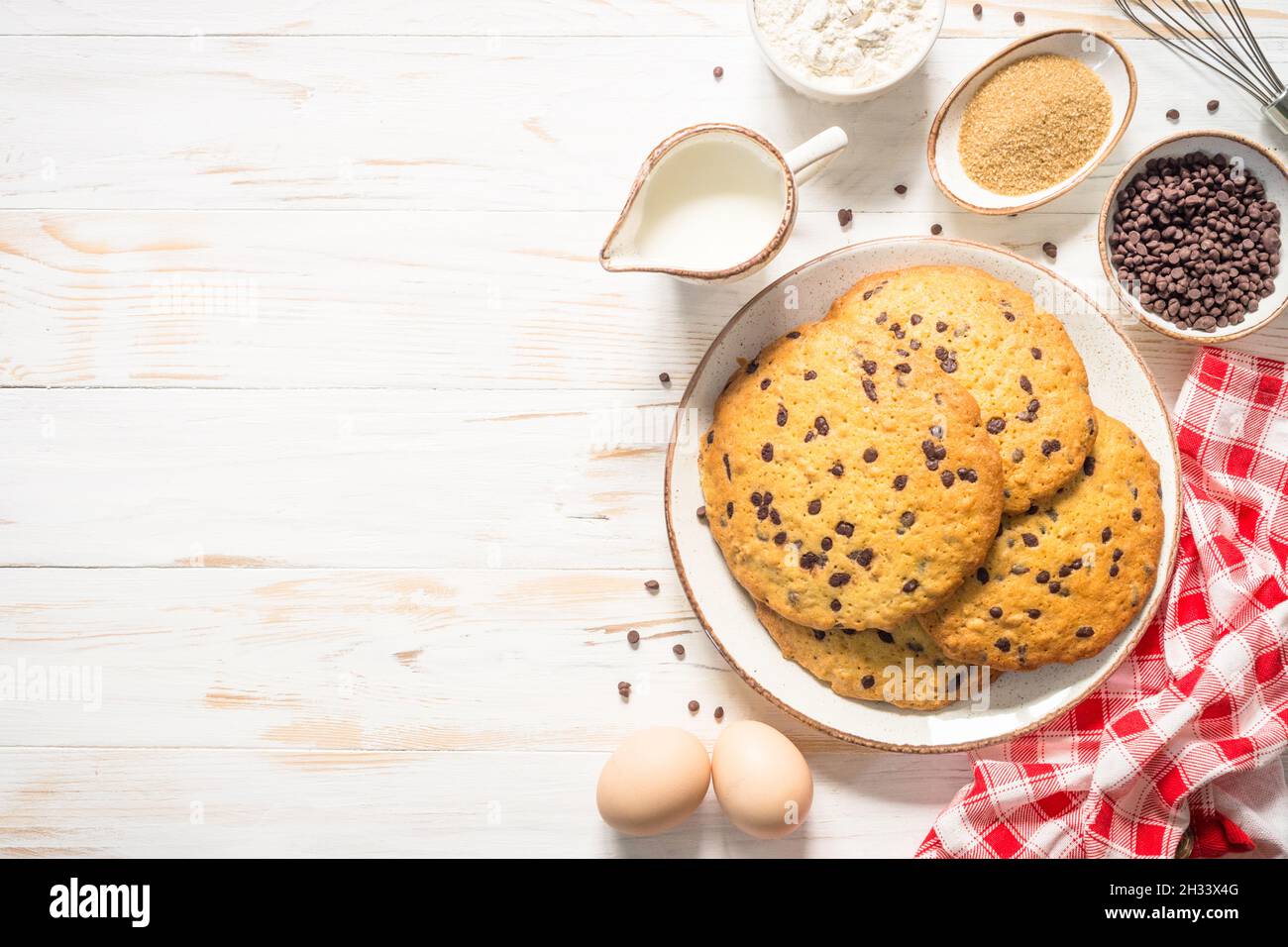 Giant cookies with chocolate chips at white table Stock Photo - Alamy