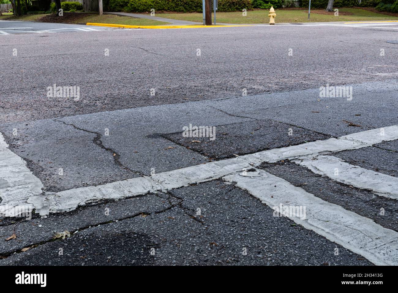 Wide view of an intersection of two streets with painted crosswalks ...