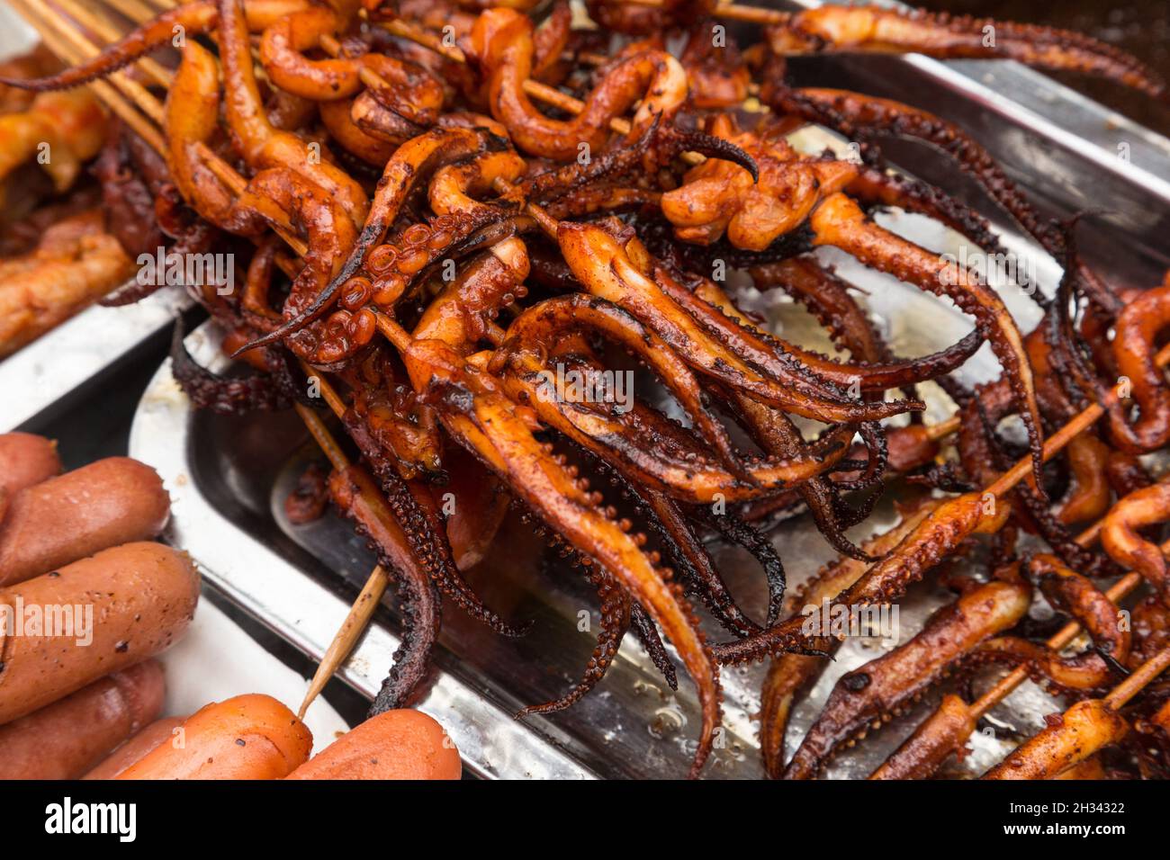Skewers of octopus tentacles for sale on the street in Old Town ...