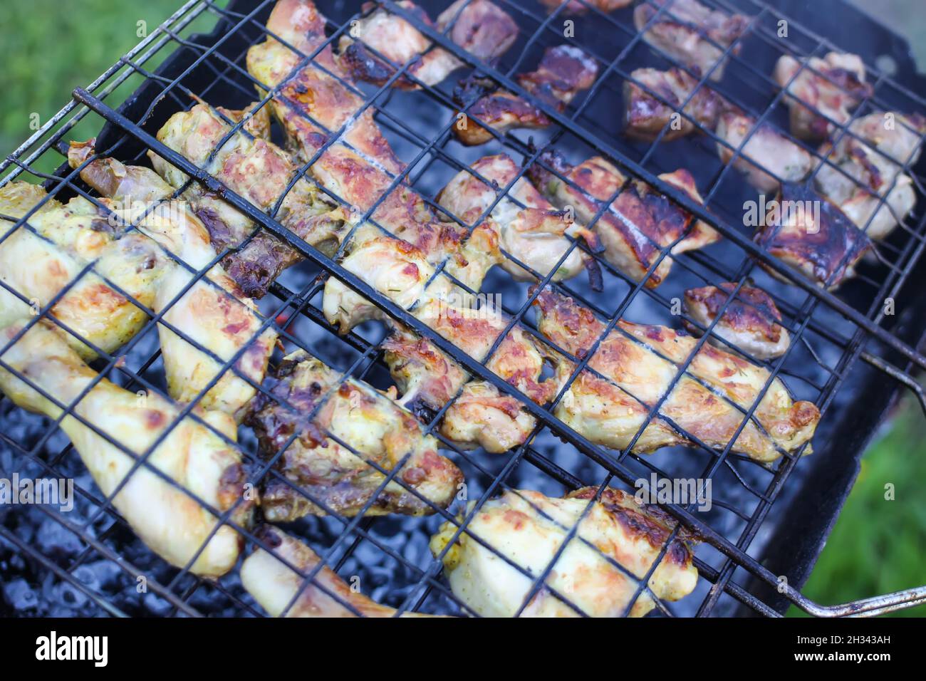 Chicken legs on grill Stock Photo - Alamy