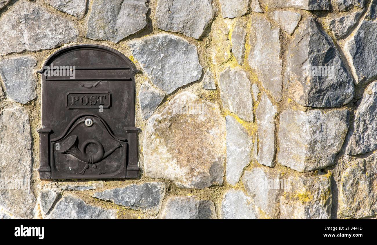 Mailboxes mounted at entry gates, mailboxes embedded in a stone wall ...