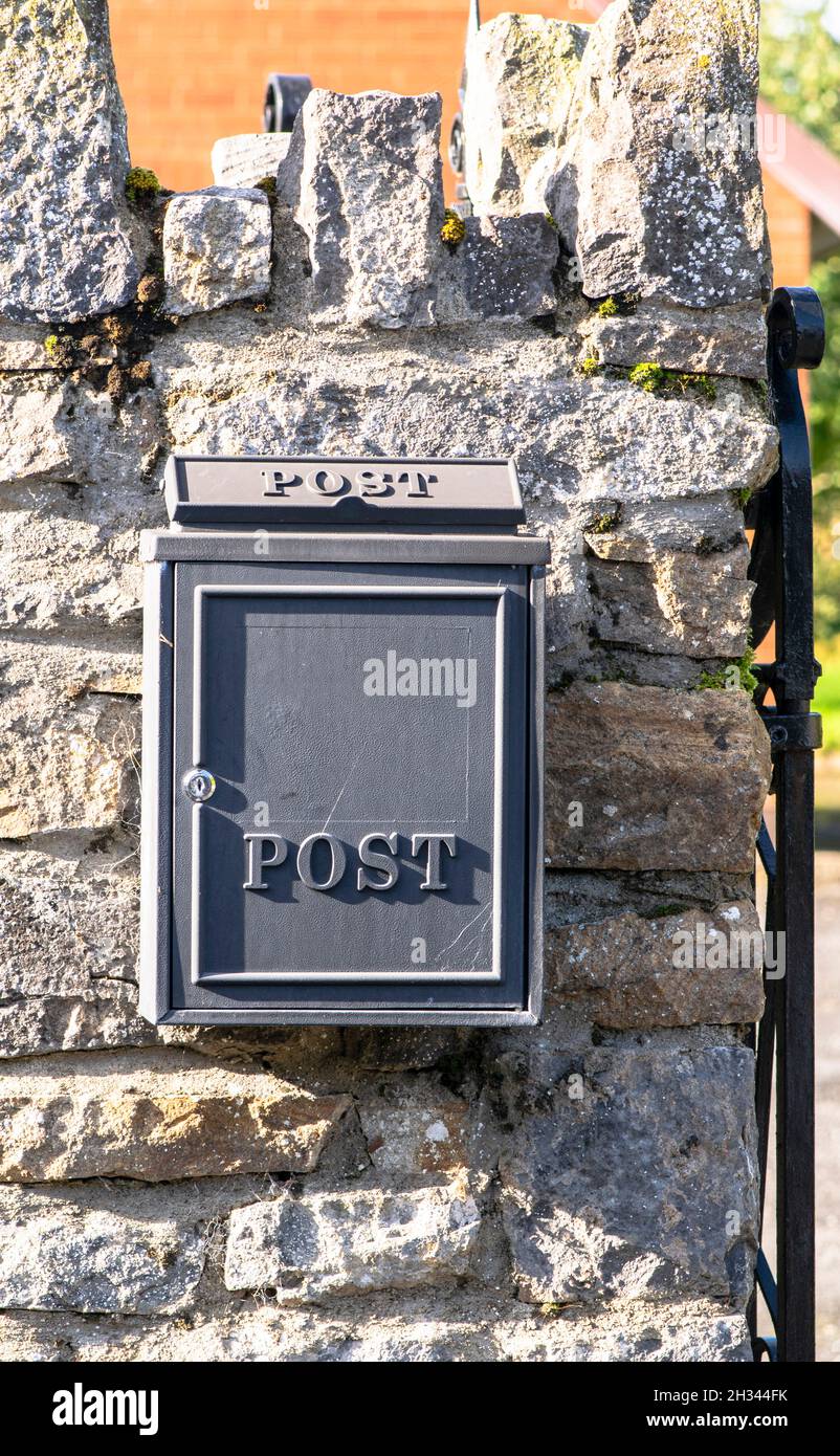 Mailboxes mounted at entry gates, mailboxes embedded in a stone wall ...