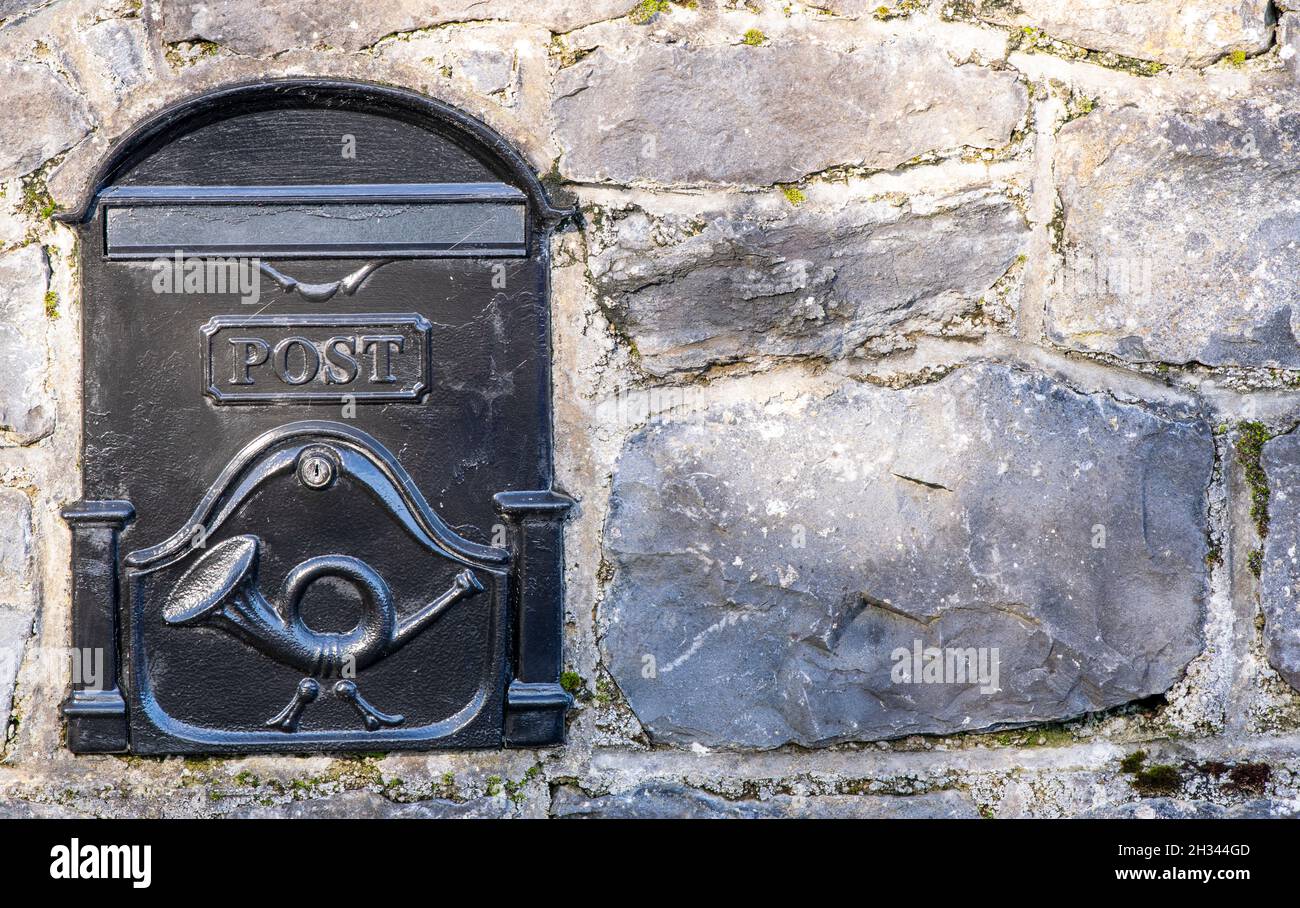 Mailboxes mounted at entry gates, mailboxes embedded in a stone wall ...