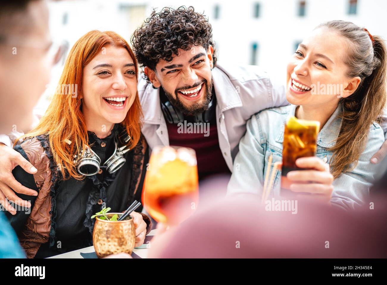 Young people having fun drinking at open air bar after work - Life ...