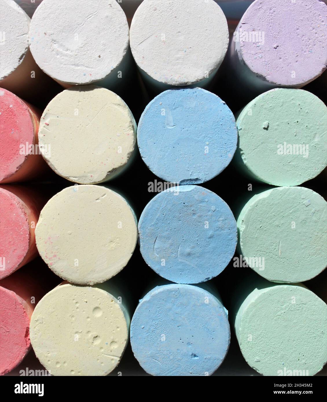 colorful round street crayon in a box assorted colors seen from above ...