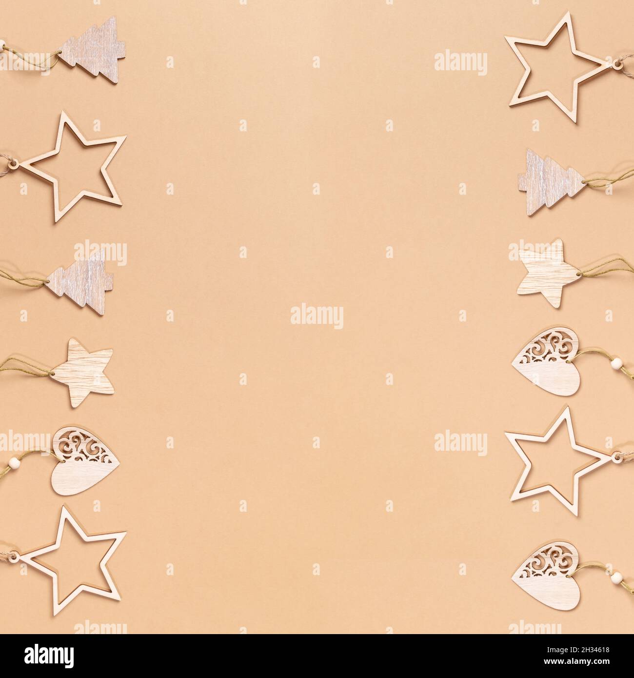 Frame of two vertical rows of Christmas festive craft decorations ...