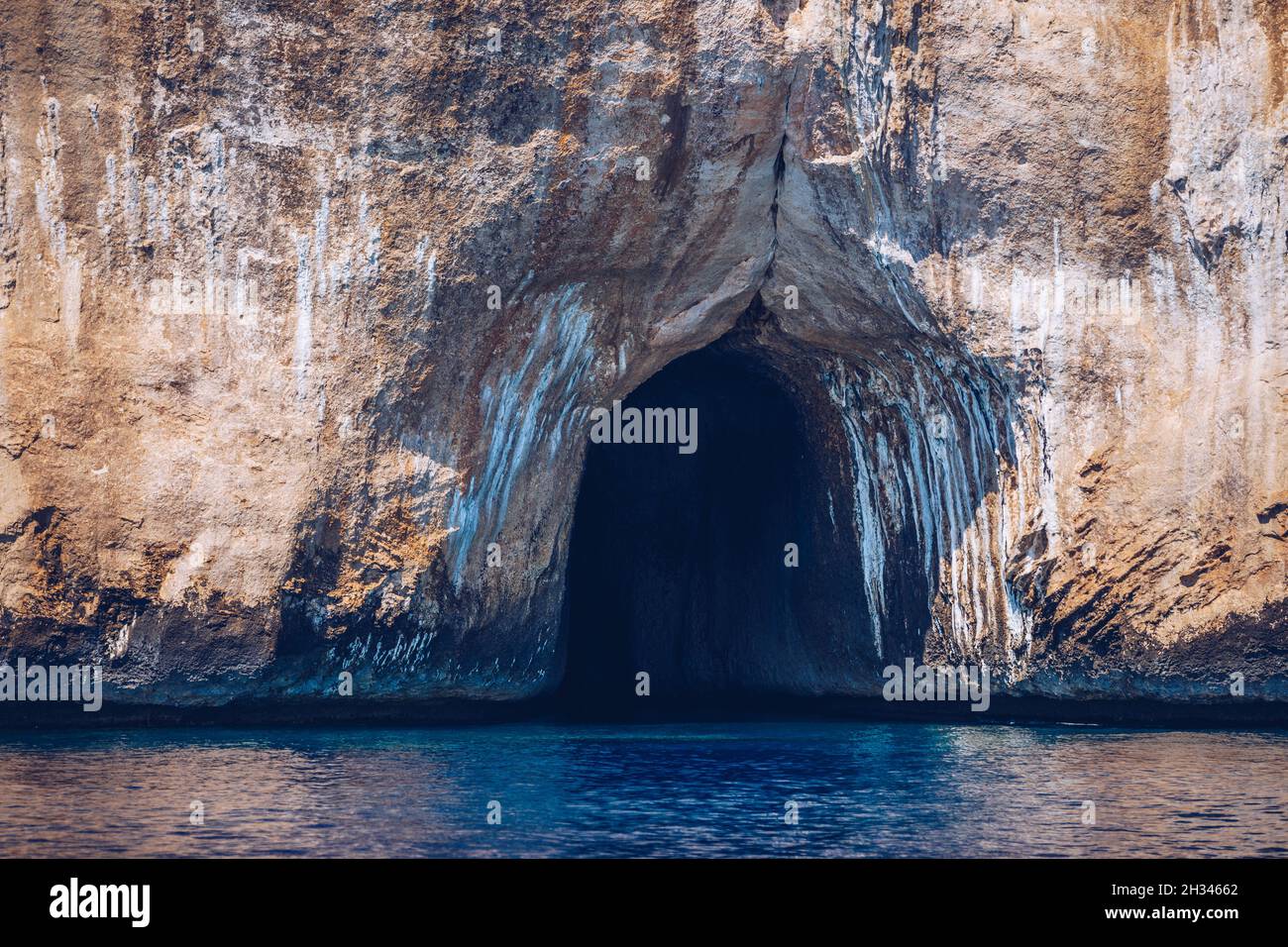 Blue sea and the characteristic caves of Cala Luna, a beach in the ...