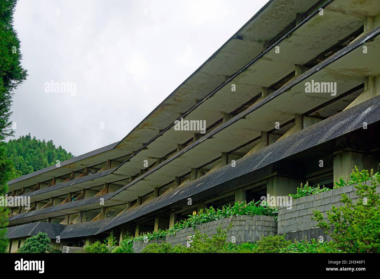 rotten structure of a hotel on the azores islands Stock Photo - Alamy