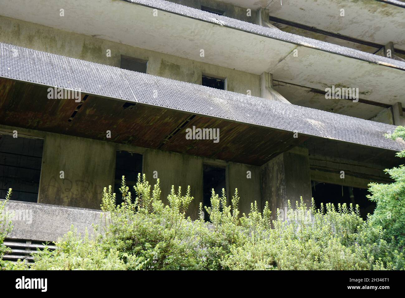 rotten structure of a hotel on the azores islands Stock Photo - Alamy