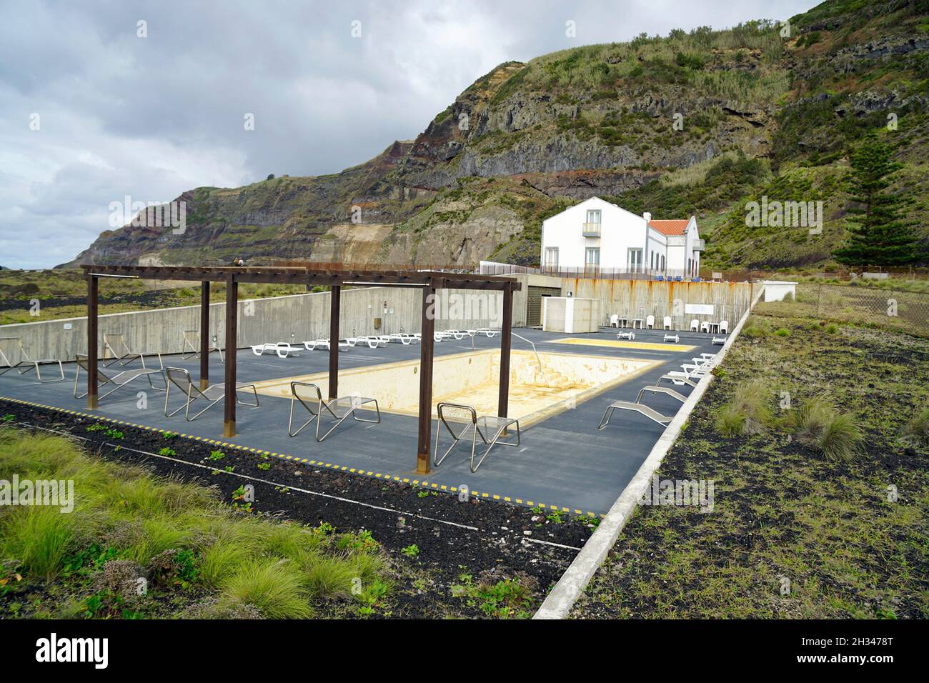 run down swimming pool on the azores islands Stock Photo - Alamy