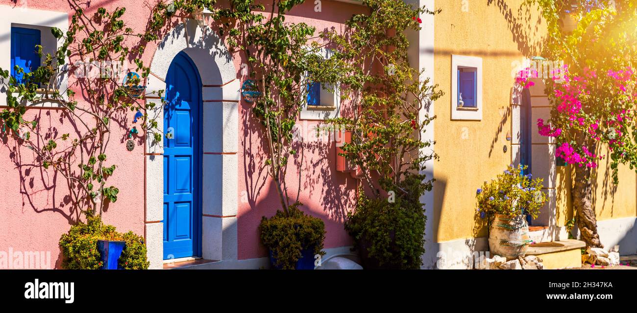 Traditional street with greek houses with flowers in Assos, Kefalonia ...