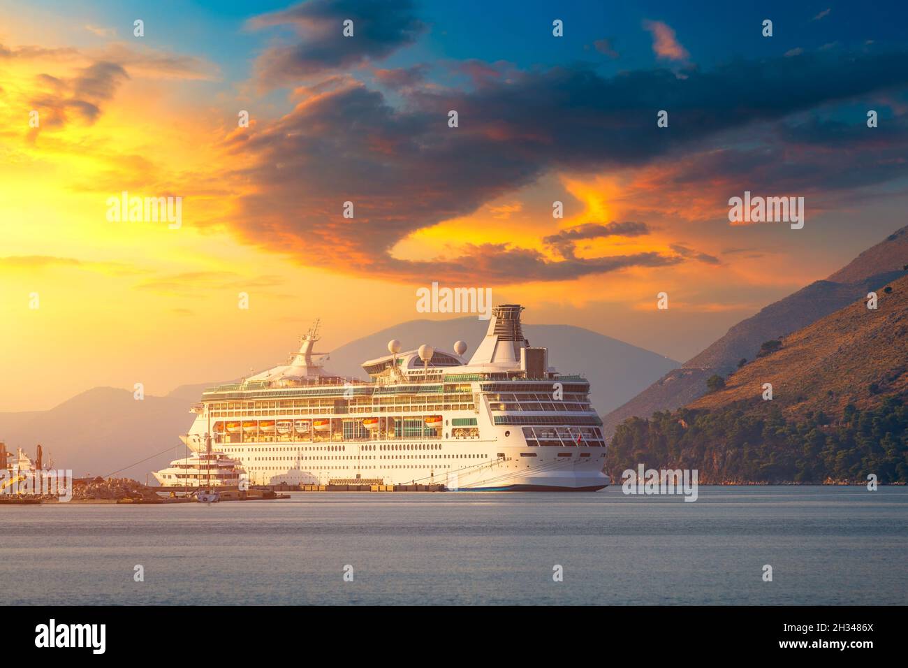 Cruise ship at harbor. Beautiful large white ship at sunset. Colorful ...