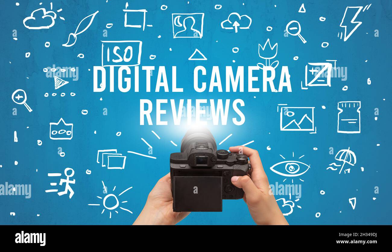 Hand taking picture with digital camera Stock Photo - Alamy