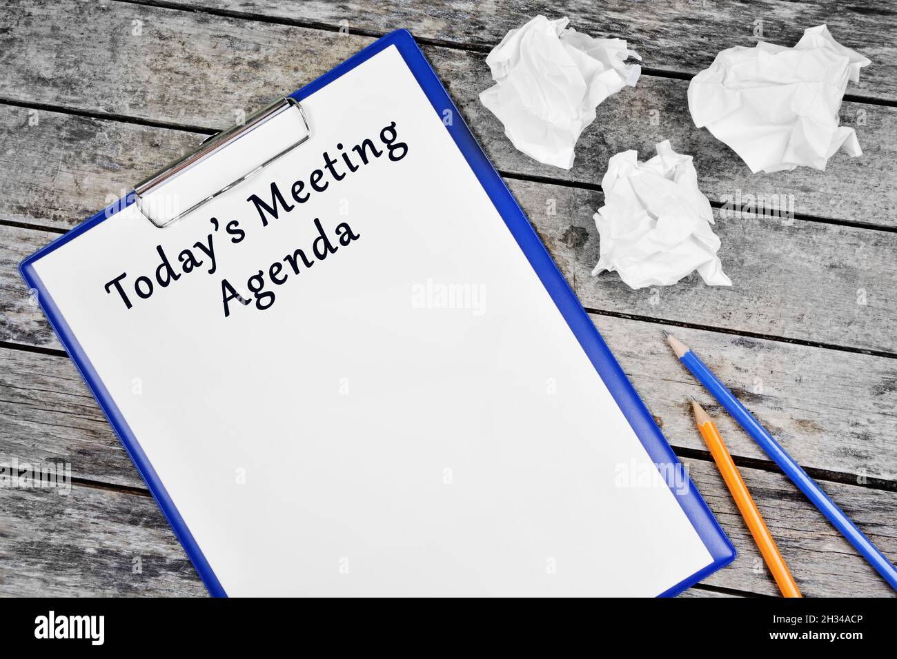 Today's meeting agenda words on white paper Stock Photo - Alamy