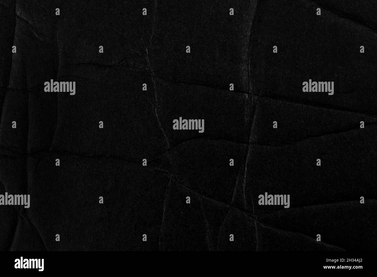 Black fractured crumpled paper surface. Broken cardboard. Abstract ...
