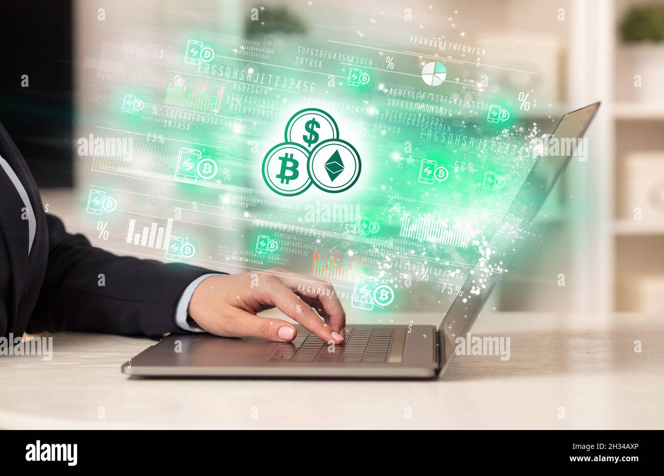 Young man watching stock market on laptop Stock Photo - Alamy
