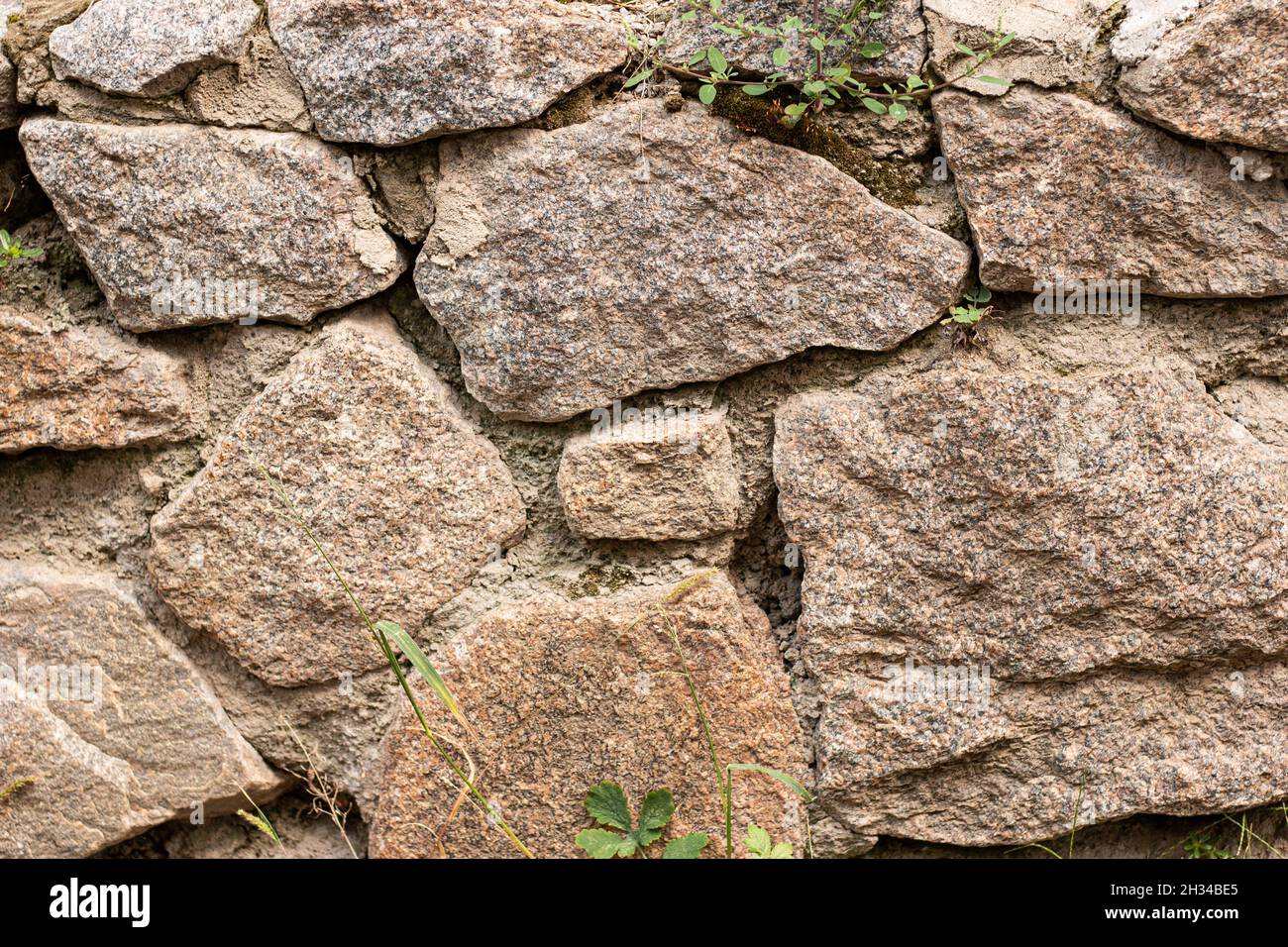 Wall made of stones Stock Photo - Alamy