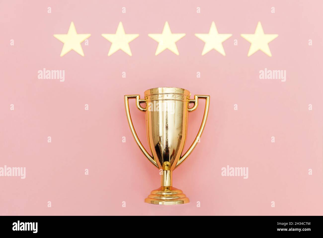 Simply flat lay design winner or champion gold trophy cup and 5 stars ...