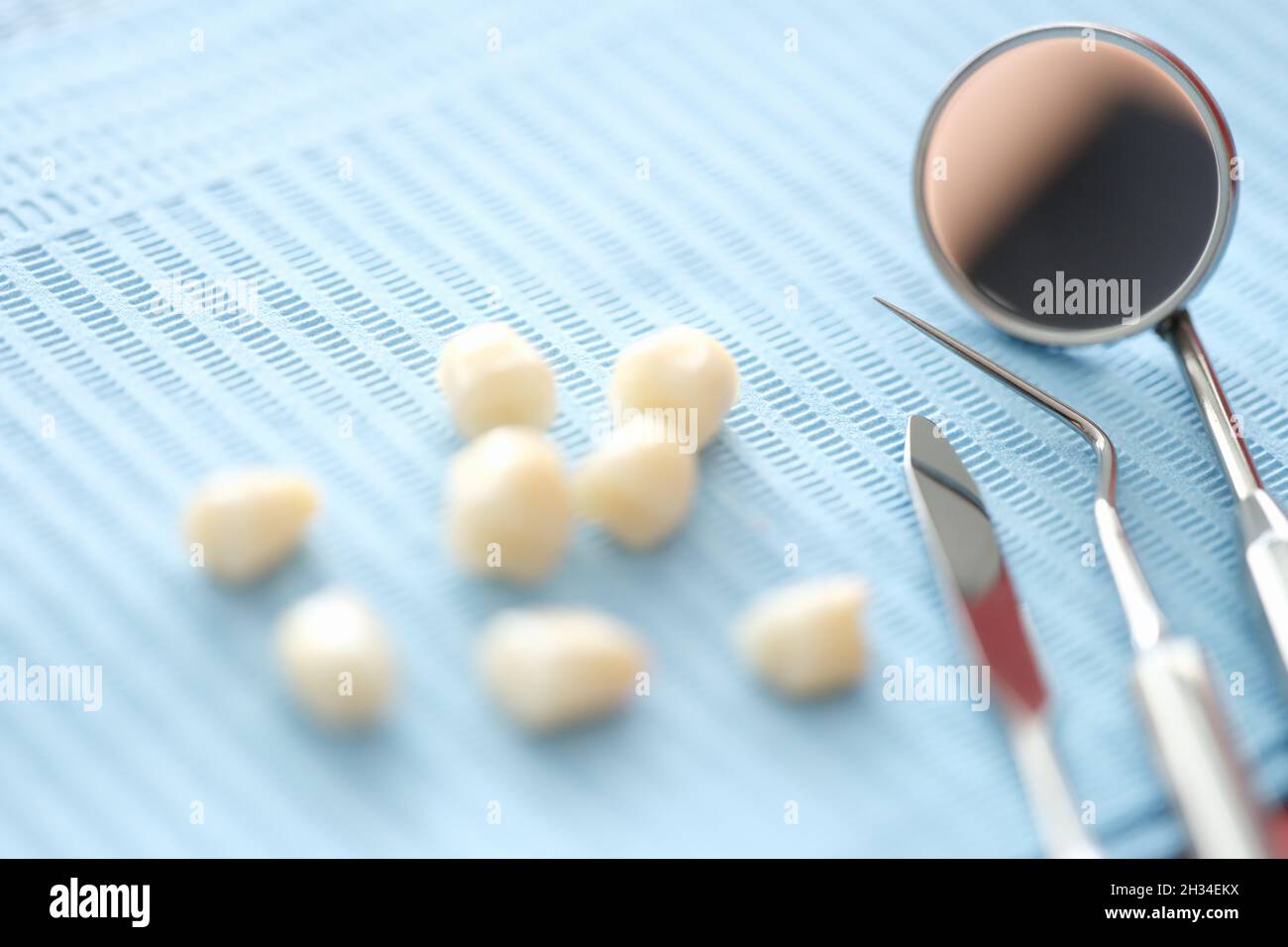 Dentures and dental instrument on table closeup Stock Photo - Alamy