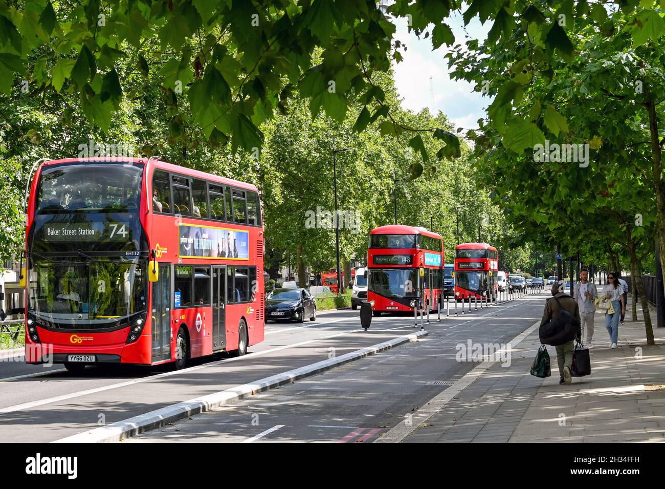 London, England - August 2021: Red London double decker buses driving ...