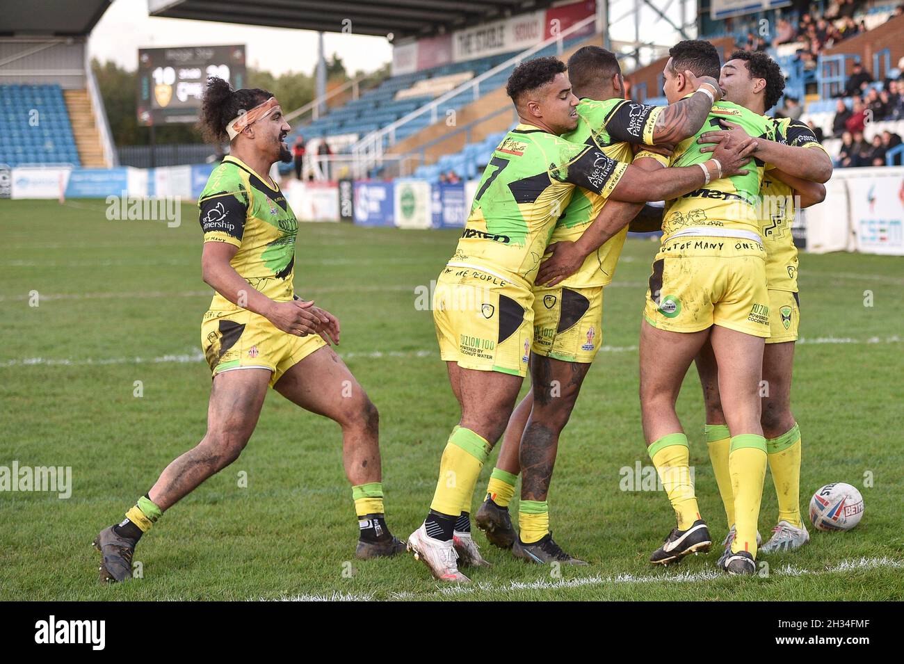 Featherstone, England - 24 October 2021 - Team mates pick up try scorer ...
