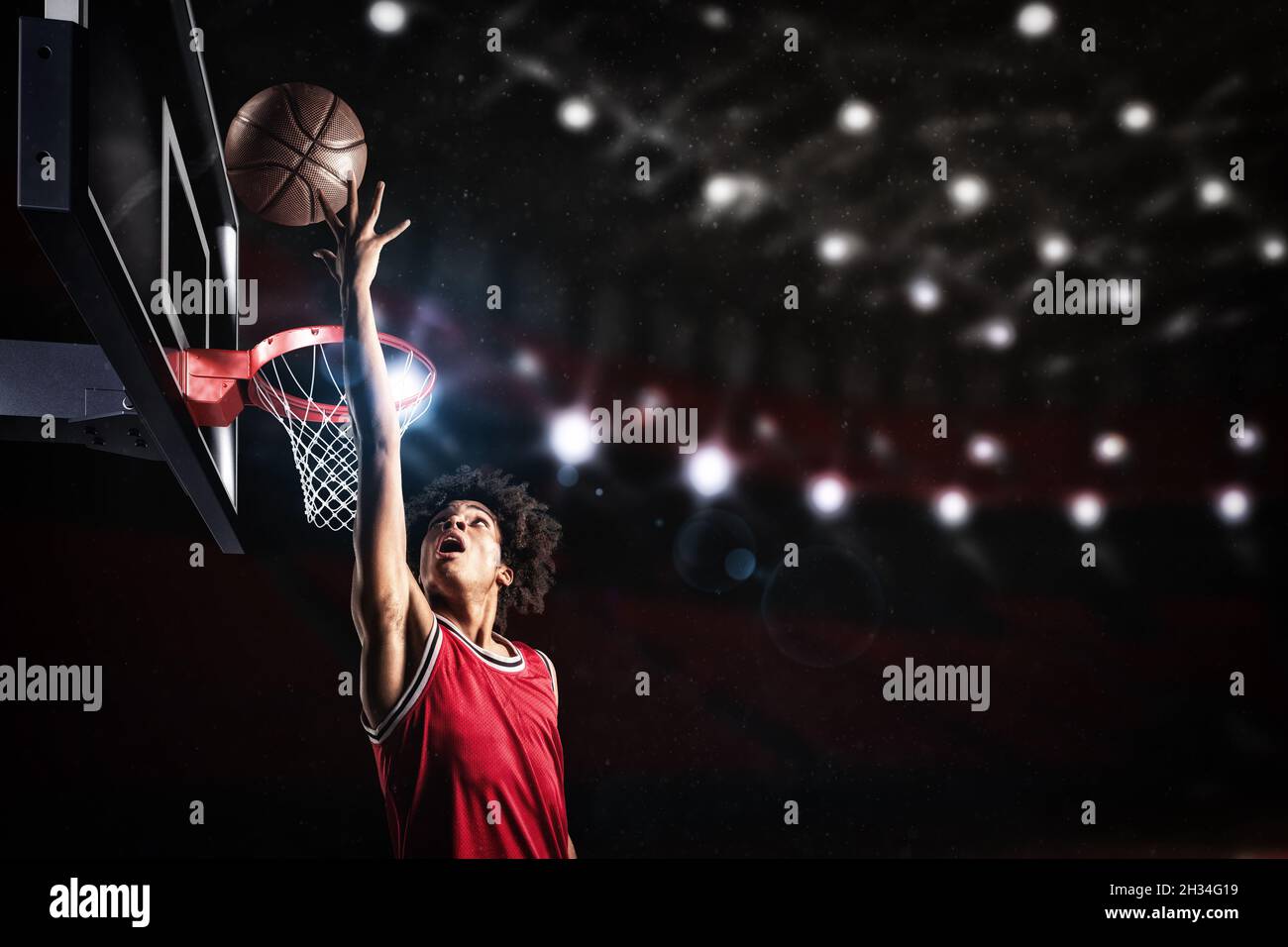 Athlete high jumping in arena hi-res stock photography and images - Alamy