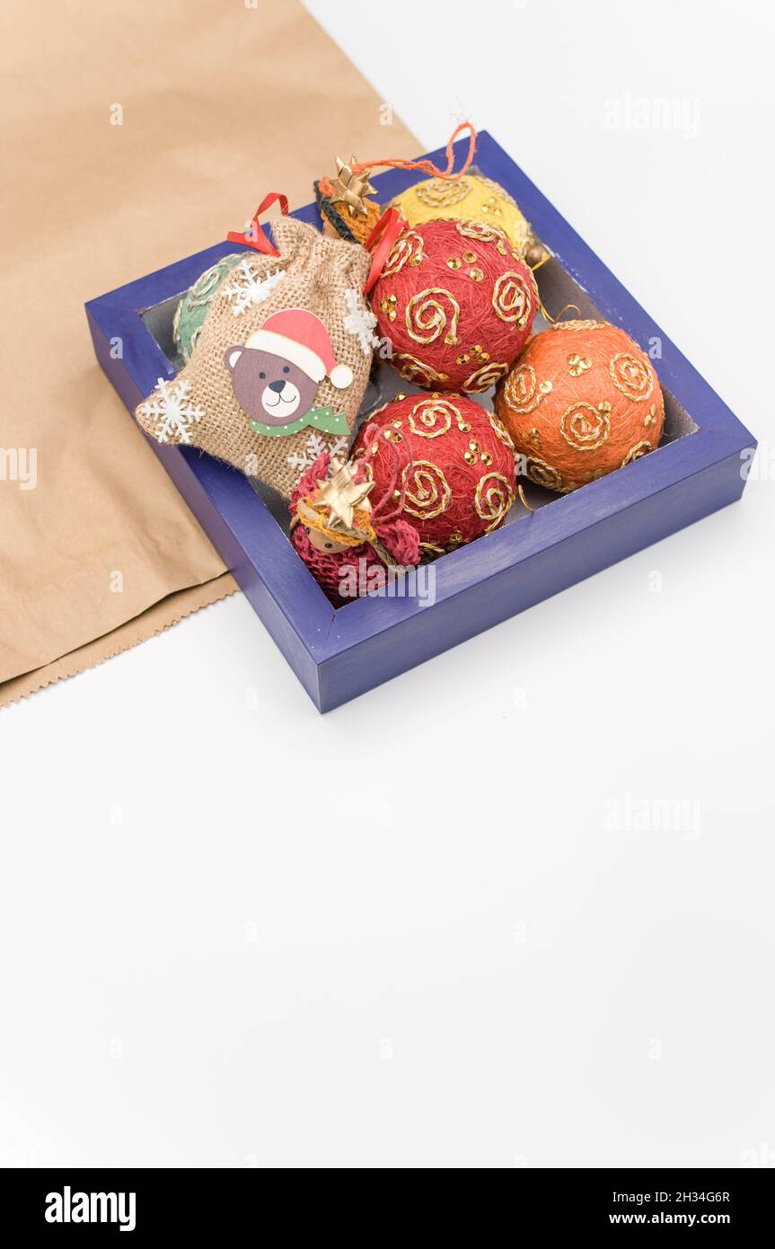 Christmas time decorations in a wooden box on a paper background Stock ...