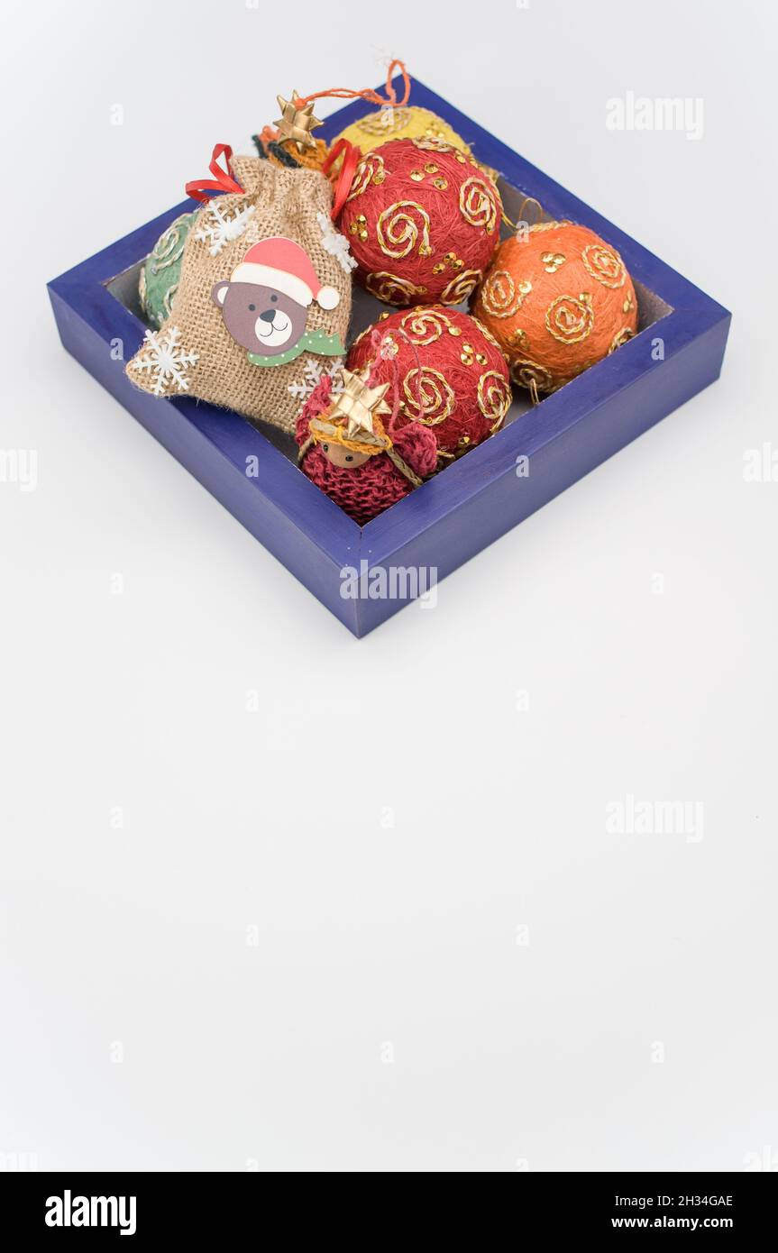 Christmas time decorations in a wooden box on white background Stock ...