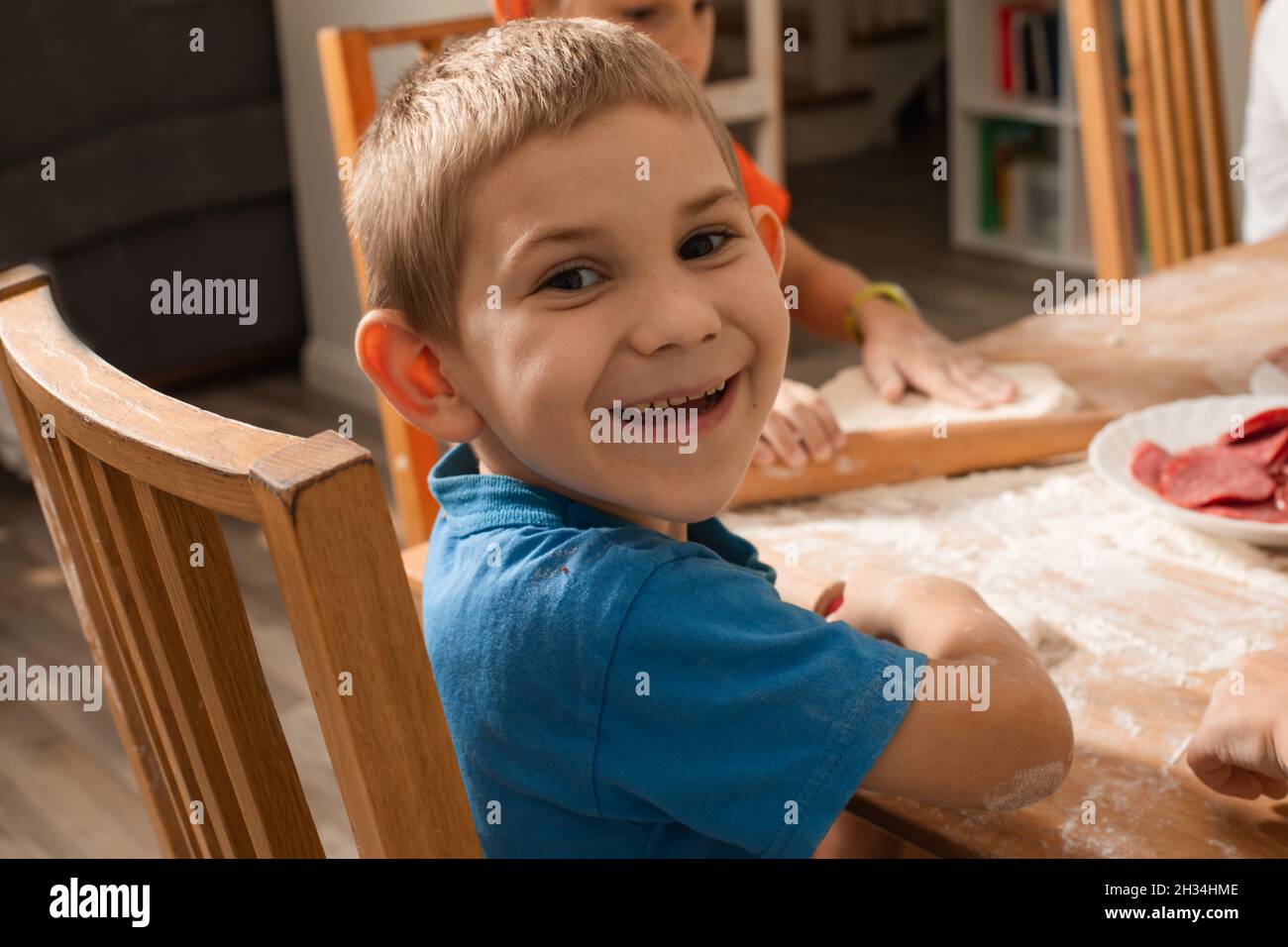 the little boy is preparing his favorite dish Stock Photo - Alamy