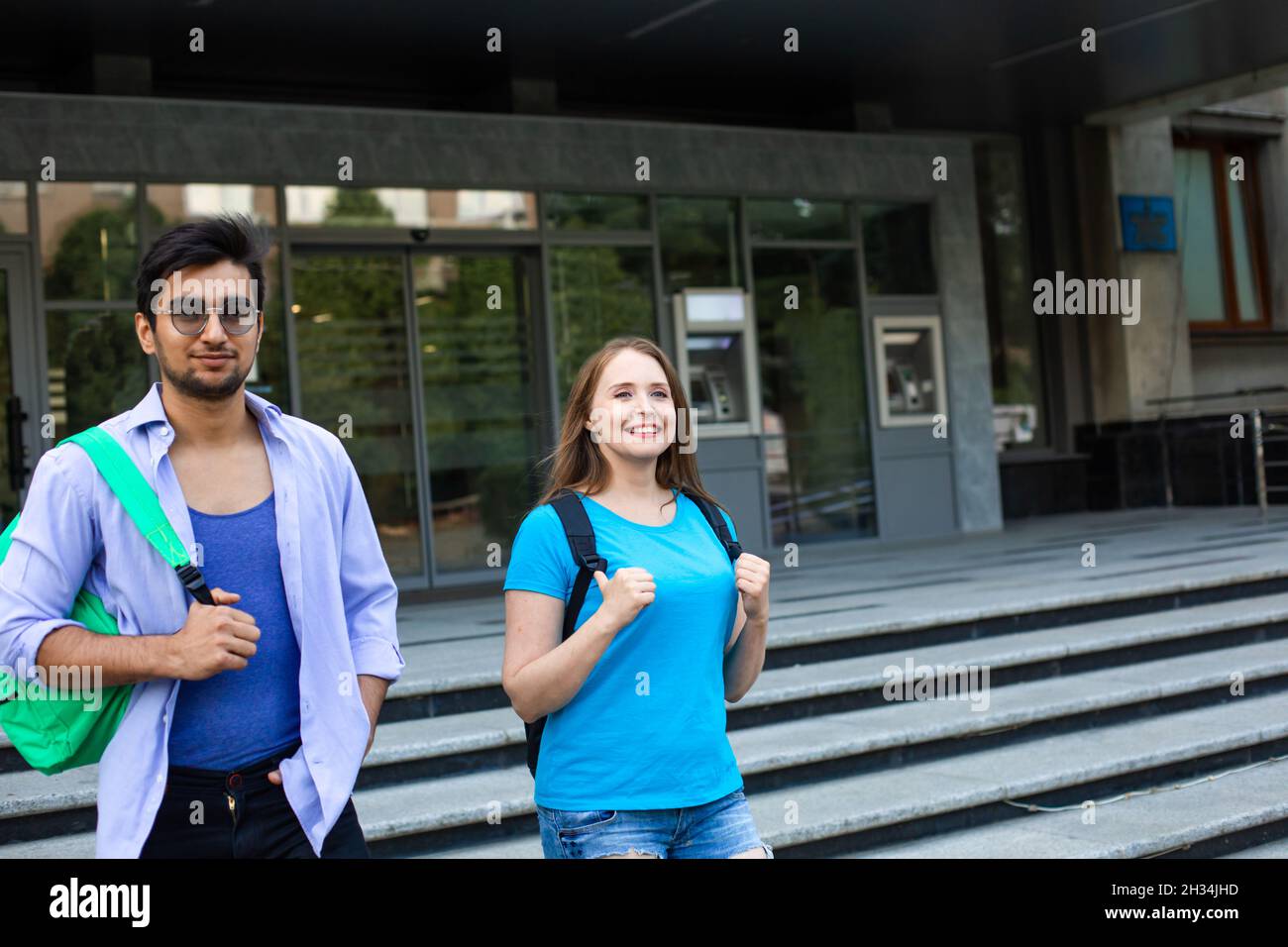 Two high school students leave the building Stock Photo - Alamy