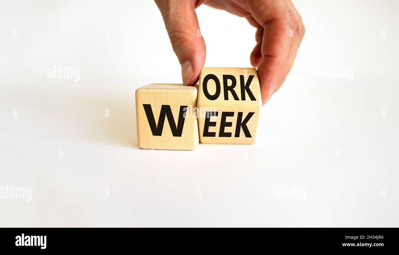 Work week symbol. Businessman turns the wooden cube with words 'Work ...