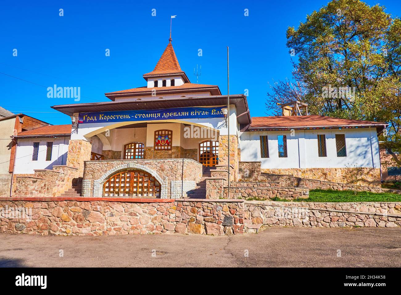 The scenic building with stone facade and with the coat of arm of ...