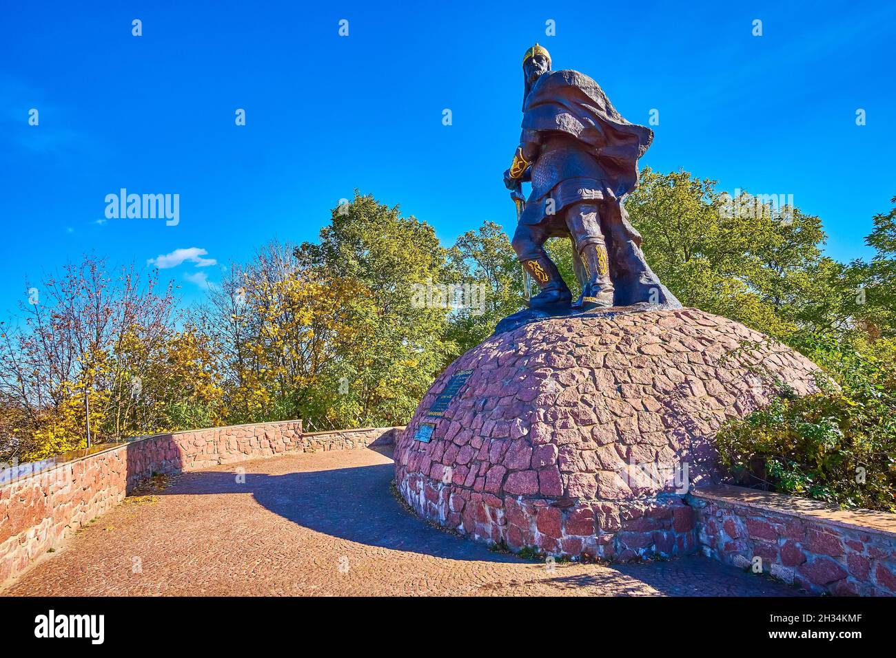 The sculpture of Prince Mal in heroic pose with a sword and in a golden ...