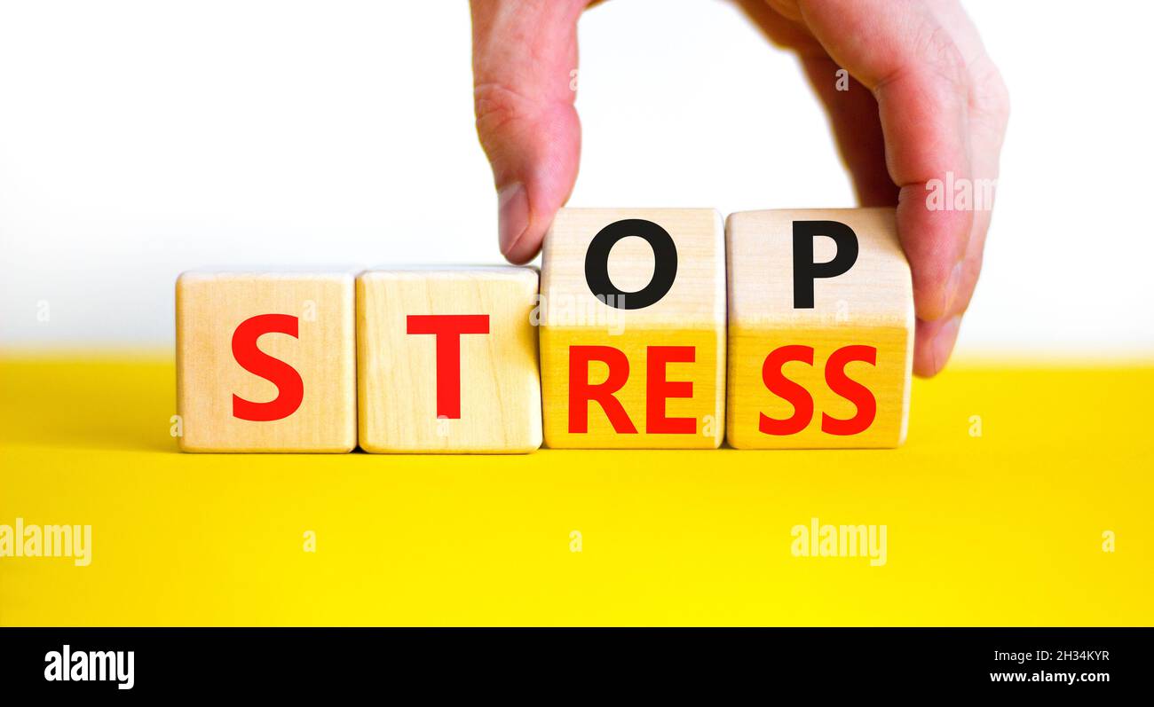 Stop stress and be health symbol. Doctor turns cubes and changes words ...
