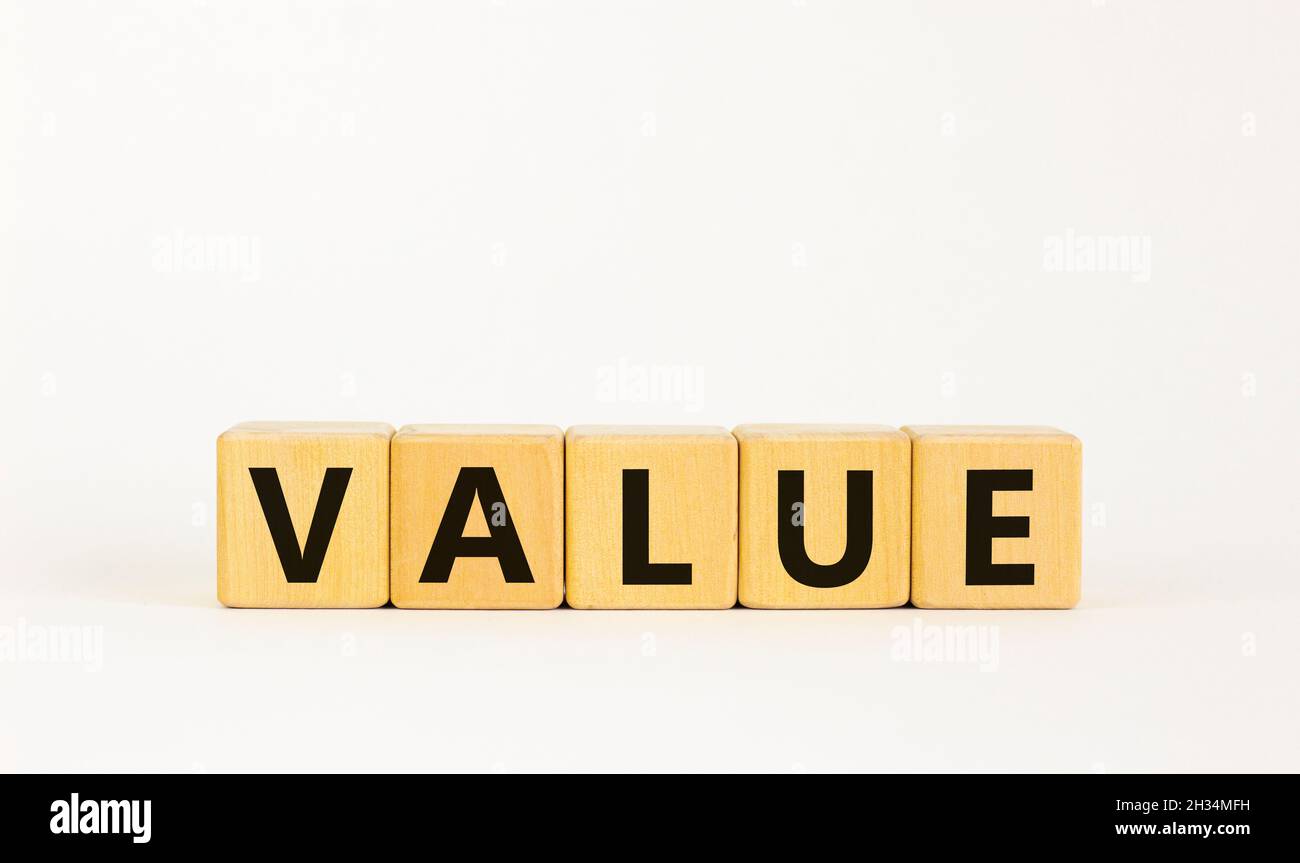 Value symbol. The concept word 'value' on wooden cubes on a beautiful ...