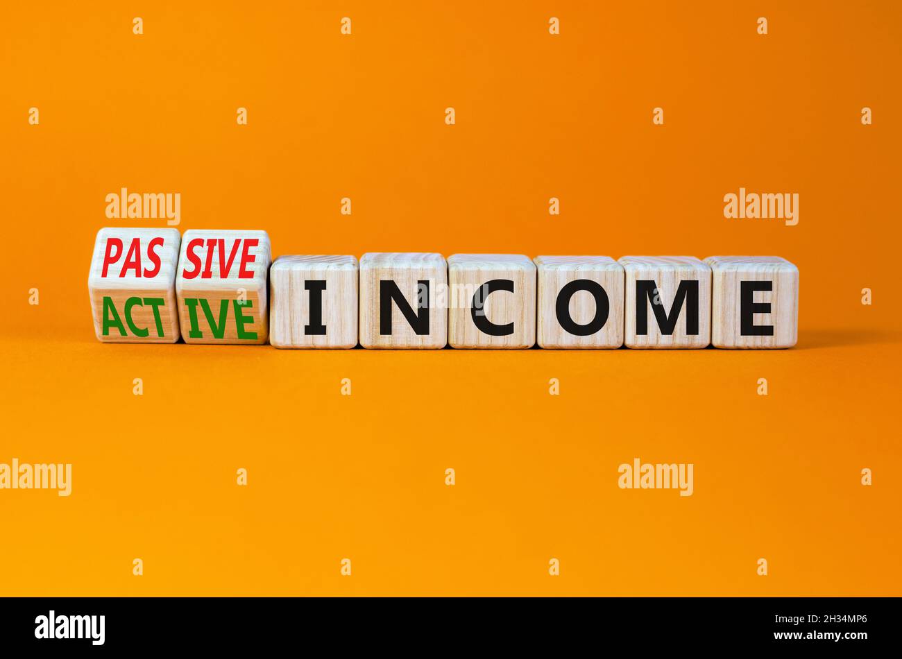 Passive or active income symbol. Turned cubes and changed words passive ...