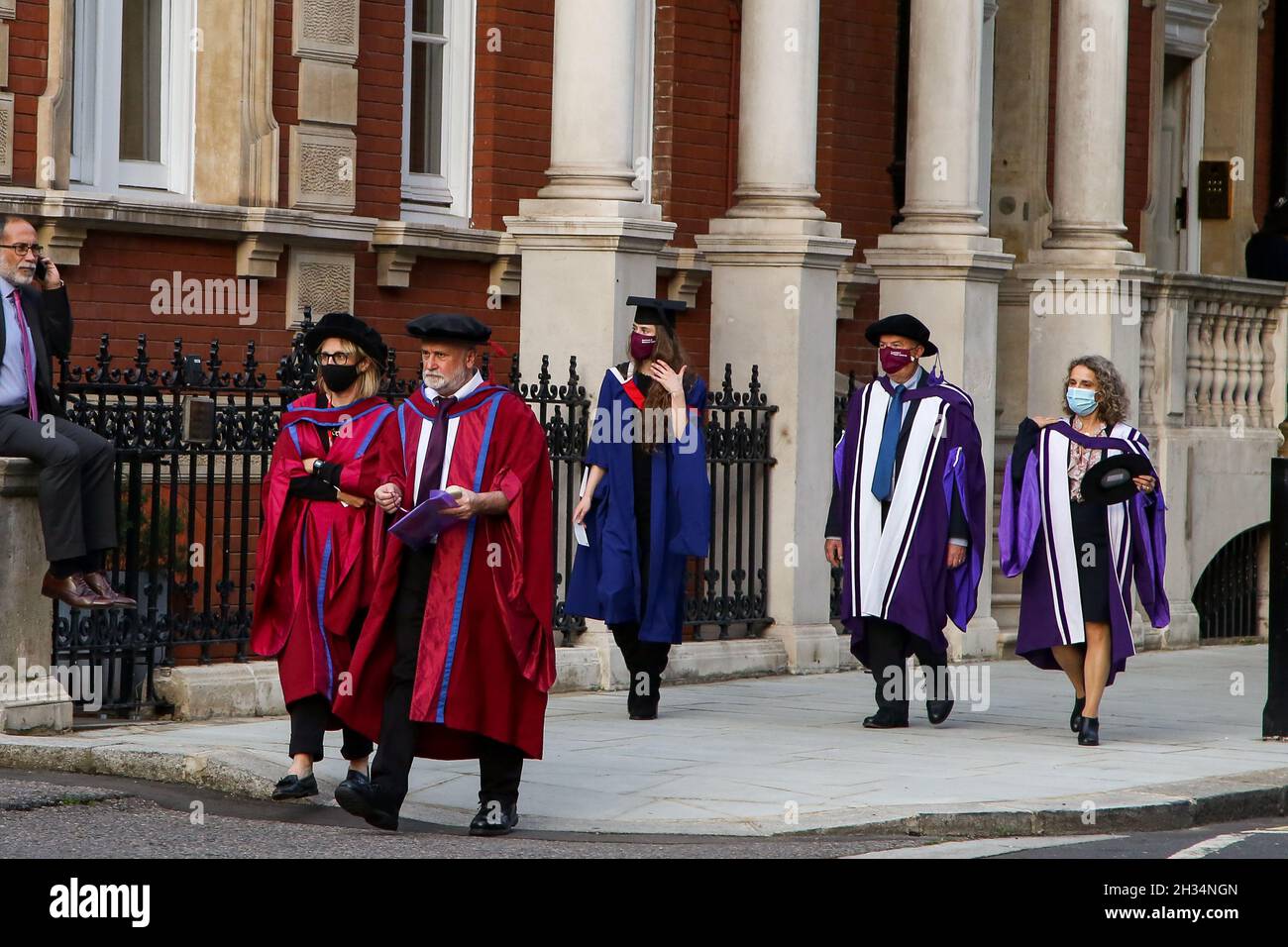 University teachers seen wearing gowns on the graduation day. Over two ...