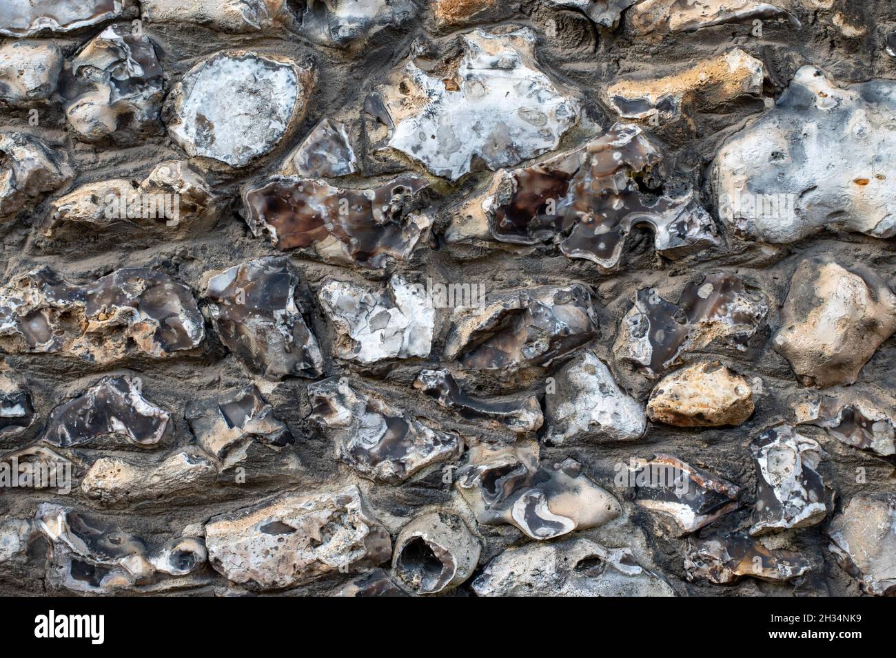 Masonry stone wall pebbledash cement and rocks Stock Photo - Alamy