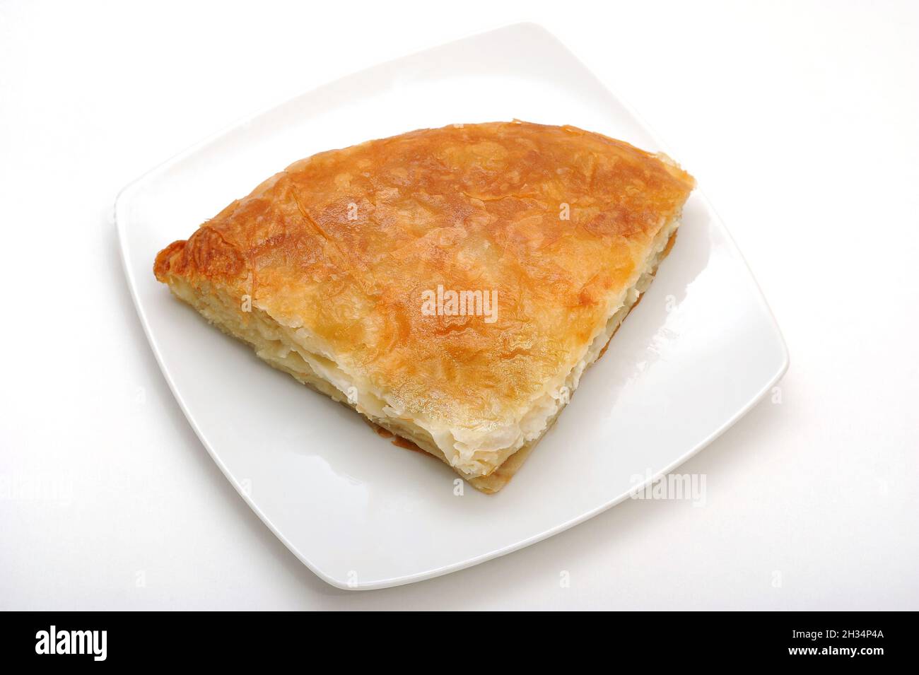 Traditional Serbian cheese pie called Burek on a white background Stock ...
