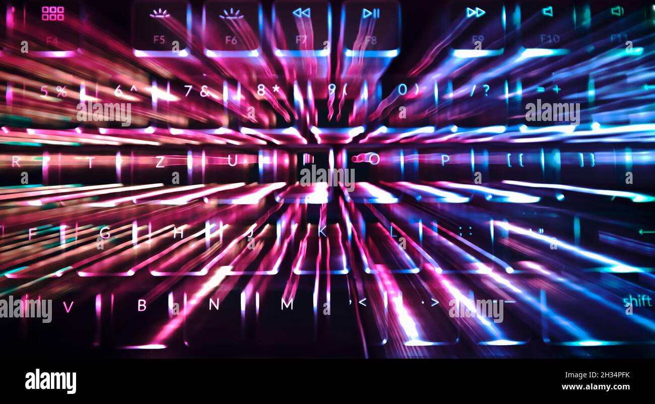 Abstract colorful background with backlighted computer keyboard theme ...