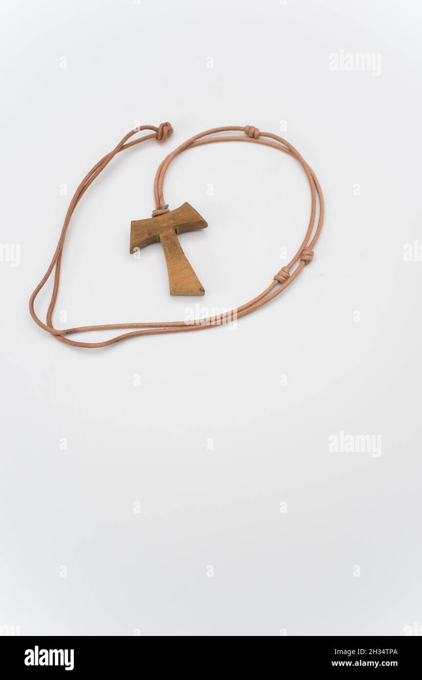 hand made wooden tau cross pendant - Greek letter tau Stock Photo - Alamy