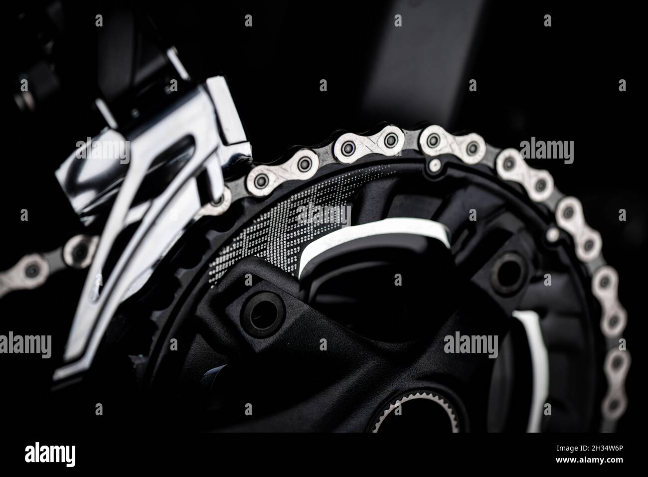 Closeup the chain and front Derailleur on the moutain bike over black ...