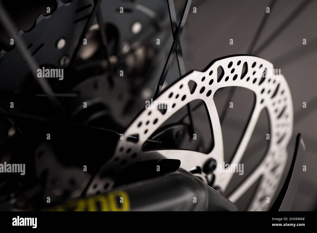 Closeup the disc break system on the moutain bike over black background ...