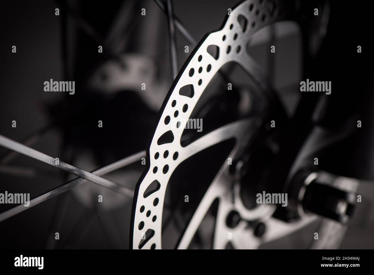 Closeup the disc break system on the moutain bike over black background ...