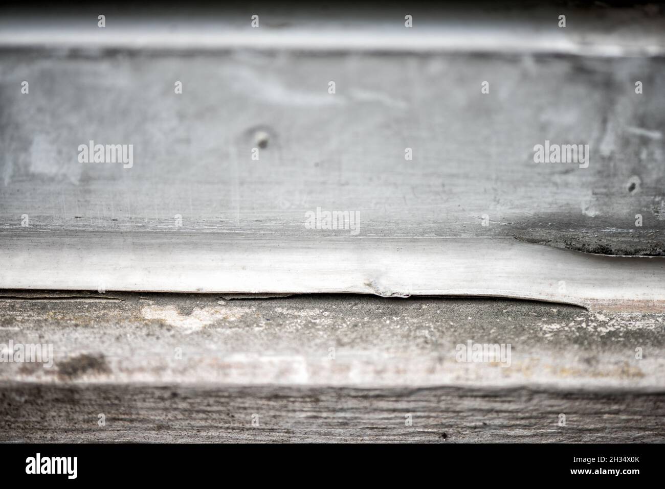 closeup old and dirty white silicone caulk on the windows frame Stock ...