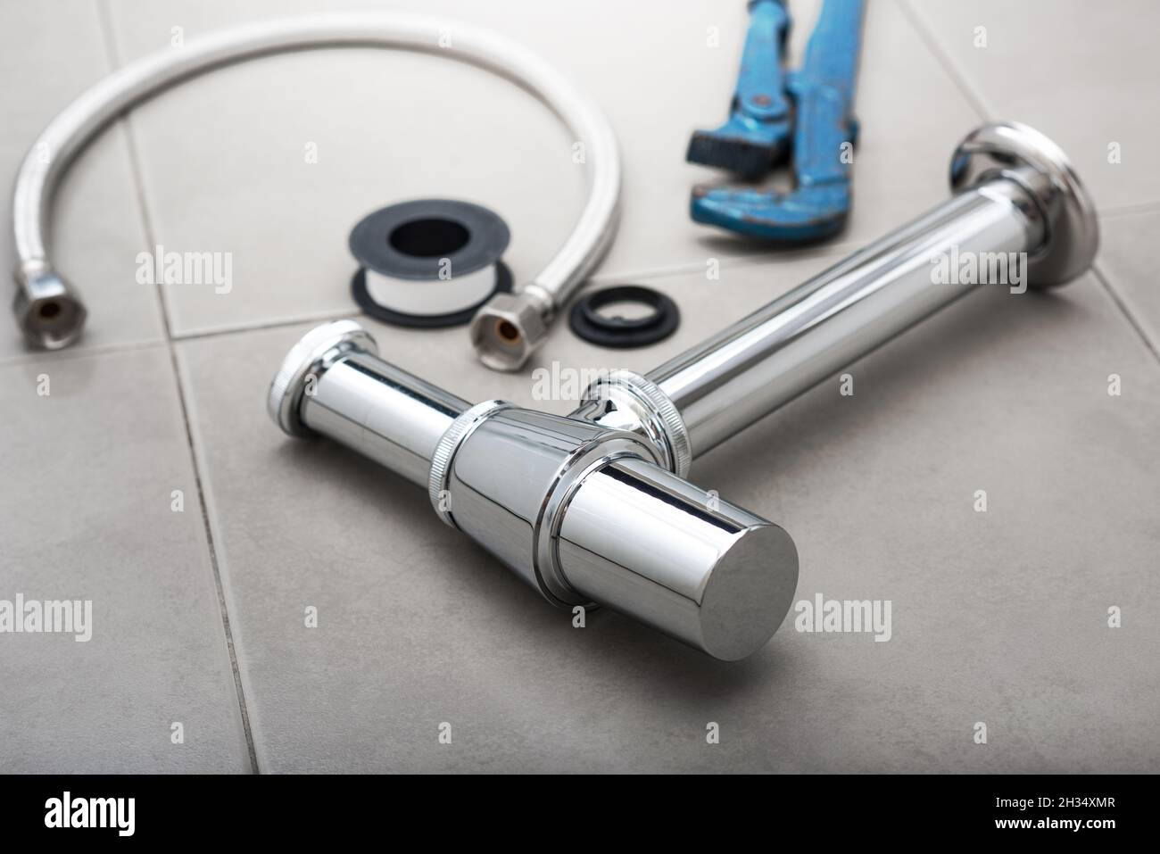 new metal siphon and other sink equipments in the bathroom Stock Photo ...
